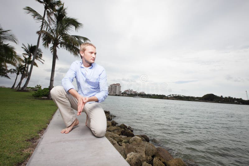 Man Posing by the Bay in Miami Beach Stock Image - Image of shirt ...