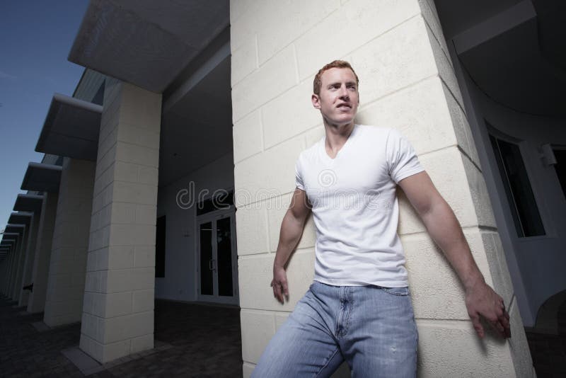 Man posing by a building stock image. Image of white - 13526181