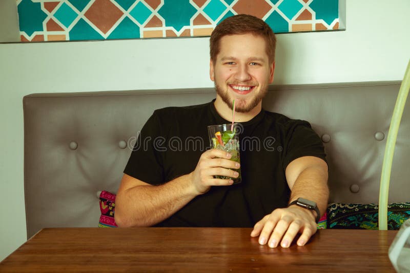 Man Posing at the Cafe and Smiling Stock Photo - Image of cafe ...