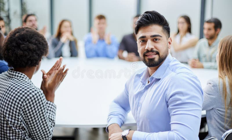 A Man Posing for the Camera while Sitting at a Round Table Stock Image ...