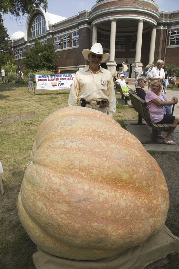 Man Posing in Front of Giant Squash Winner, Editorial Image - Image of ...