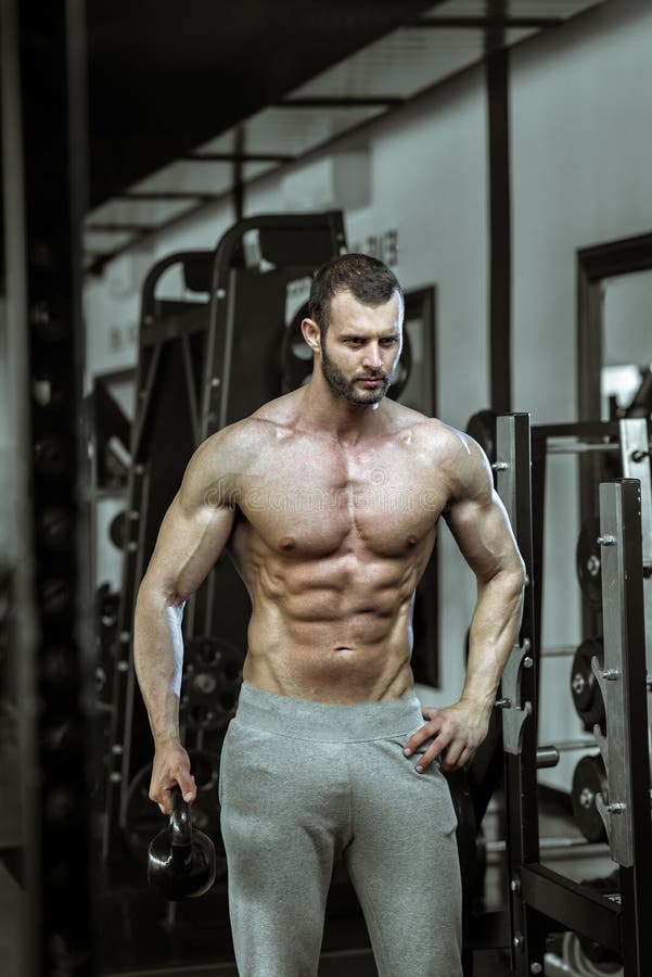 Man Posing in Gym Showing Abs Stock Image - Image of lifting, person ...