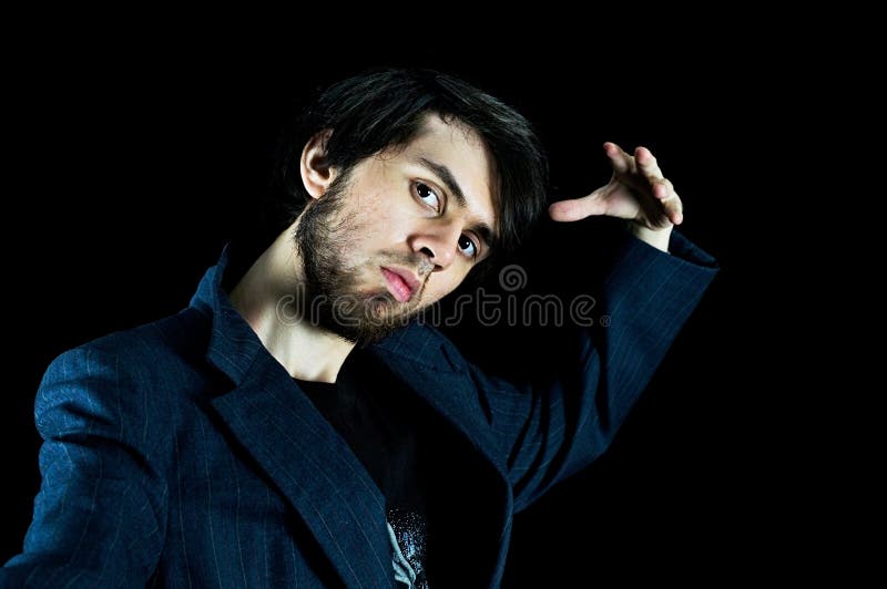 Man Posing with His Left Hand Up, with His Head Tilted Stock Photo ...