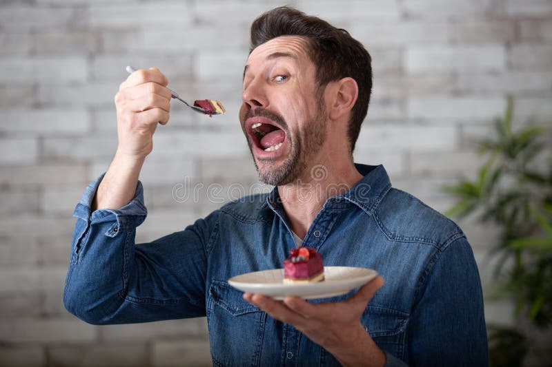 Man Posing with Mouth Open while Eating Cake Stock Image - Image of ...
