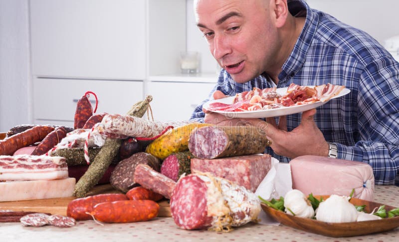 Man Posing with a Plate of Cold Cuts Stock Photo - Image of chorizo ...