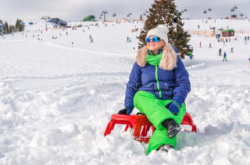 Man Posing on a Red Sleigh Riding Stock Image - Image of activity ...