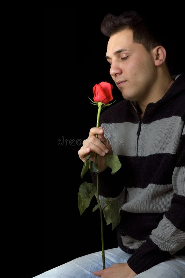 Man in posing with rose stock photo. Image of sensitive - 7924716
