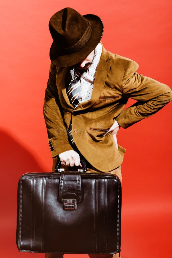 Man Posing in Studio with Suitcase in Hands Stock Image - Image of ...