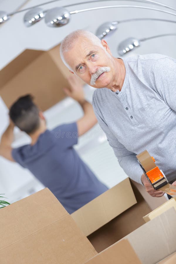 Man Taping Moving Box Photos - Free & Royalty-Free Stock Photos from ...