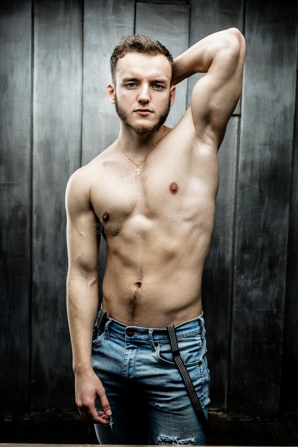 Man posing wearing jeans stock image. Image of bodybuilder - 68878193