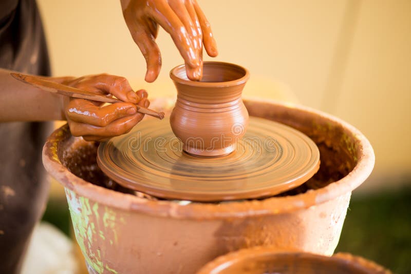 Man Potter Work with Clay Ware. Young Man Potter on His Workshop with ...