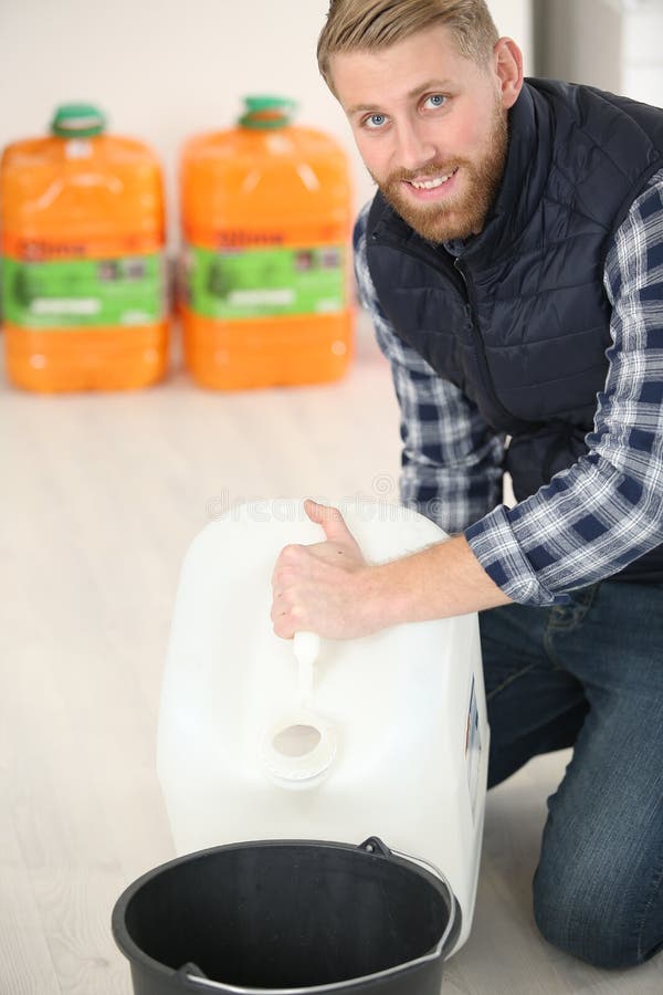 Man with Pour Fuel in Bucket Stock Photo - Image of decant, background ...