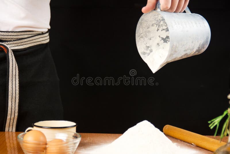 Man Pouring Flour from the Measure Bowl Stock Photo - Image of people ...