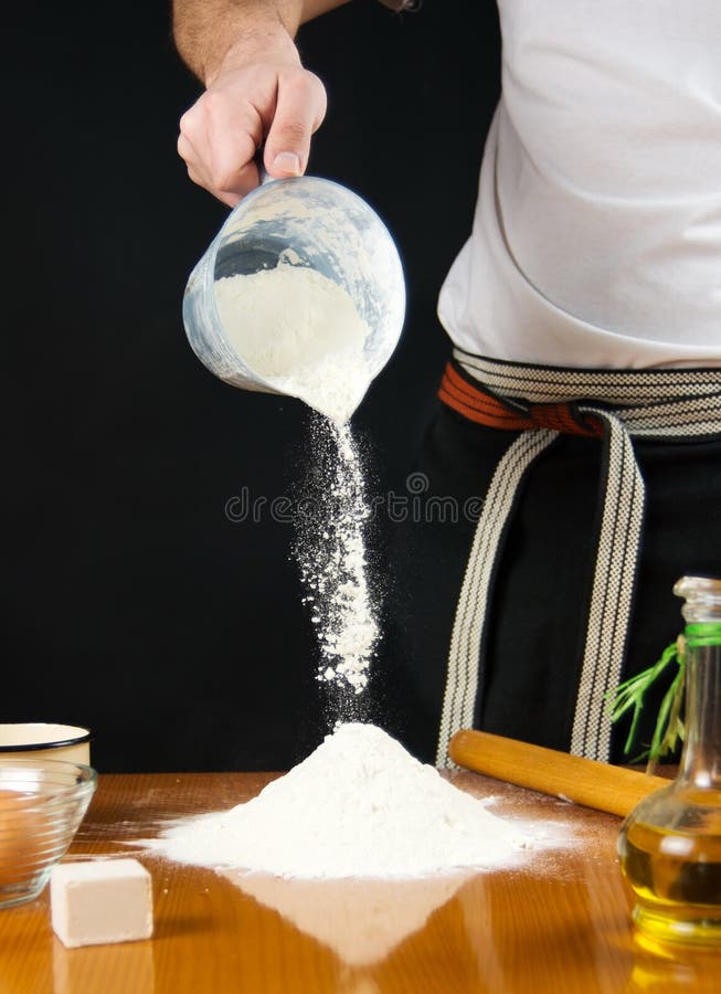 Man Pouring Flour from the Measure Bowl Stock Photo - Image of person ...