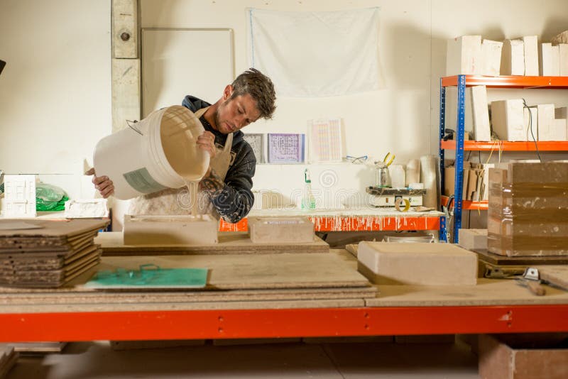 Man Pouring Gypsum Mixture Onto Mold Stock Image - Image of craft ...