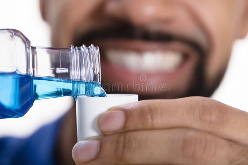 Man Pouring Mouthwash into Cap Stock Photo - Image of antiseptic, hold ...
