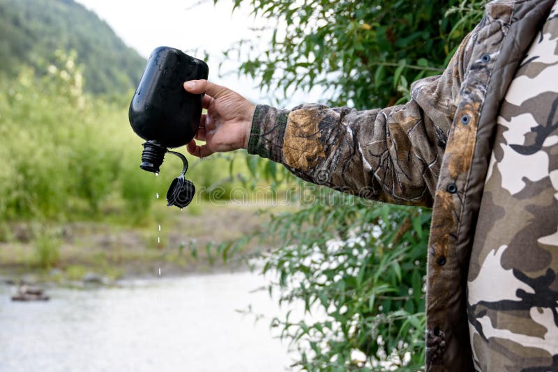 Man pouring out old water stock photo. Image of nature - 78035144