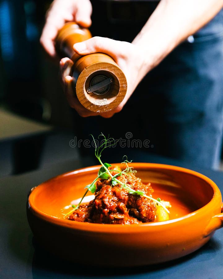 Man Pouring Pepper on Beef Cheeks in a Bowl Stock Image - Image of menu ...