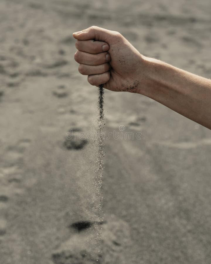 Man Pouring Sand through Hand in Desert Stock Image - Image of alone ...