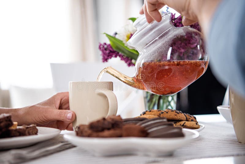 Man Pouring Tea into Cup during Breakfast at Home Stock Photo - Image ...