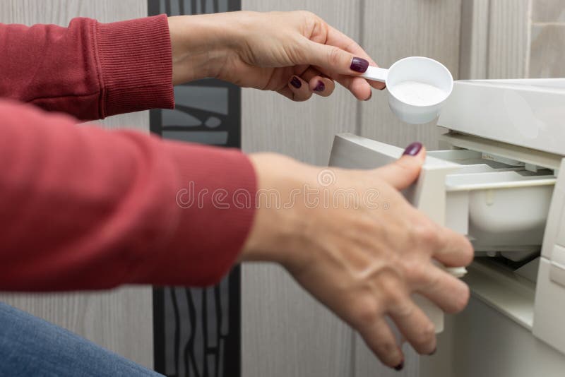 Man Pouring Washing Powder into the Washing Machine. Stock Photo ...