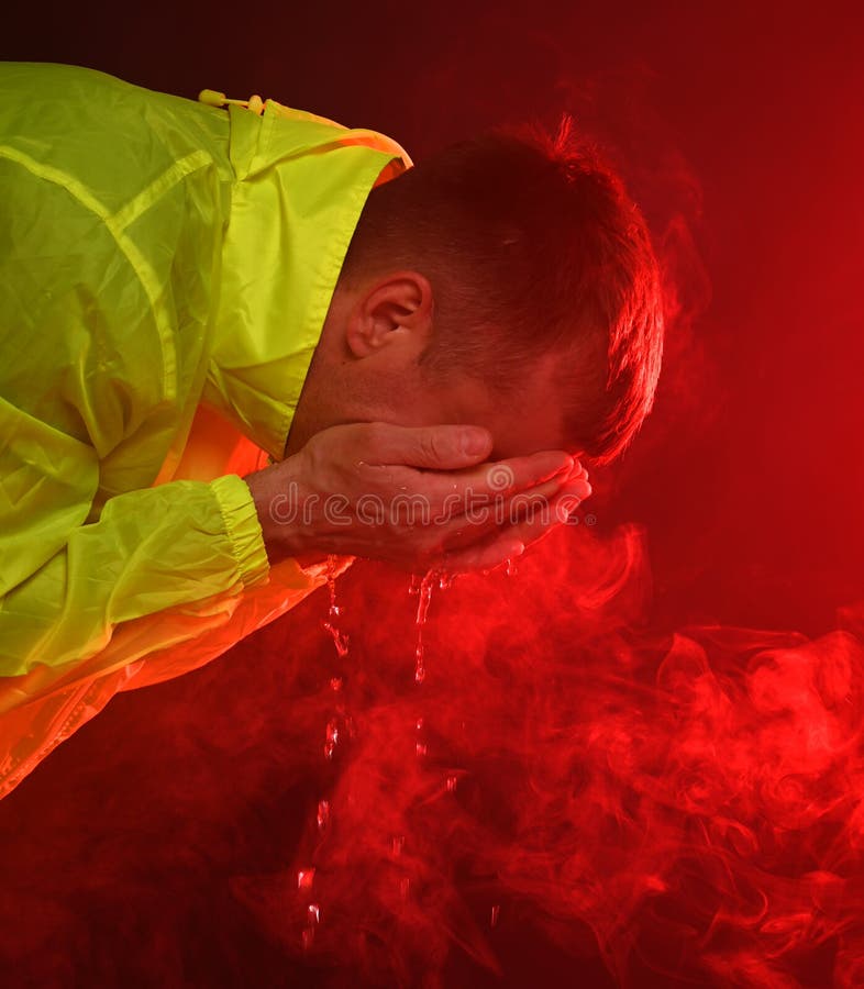 Man Pouring Water on His Face during Dangerous Situation Stock Photo ...