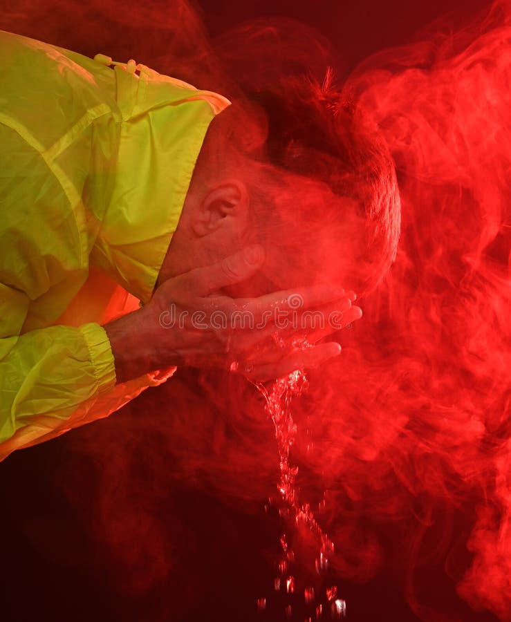 Man Pouring Water on His Face during Dangerous Situation Stock Photo ...