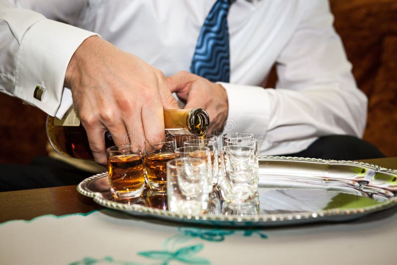 Man pouring whiskey stock image. Image of party, distilled - 33998471