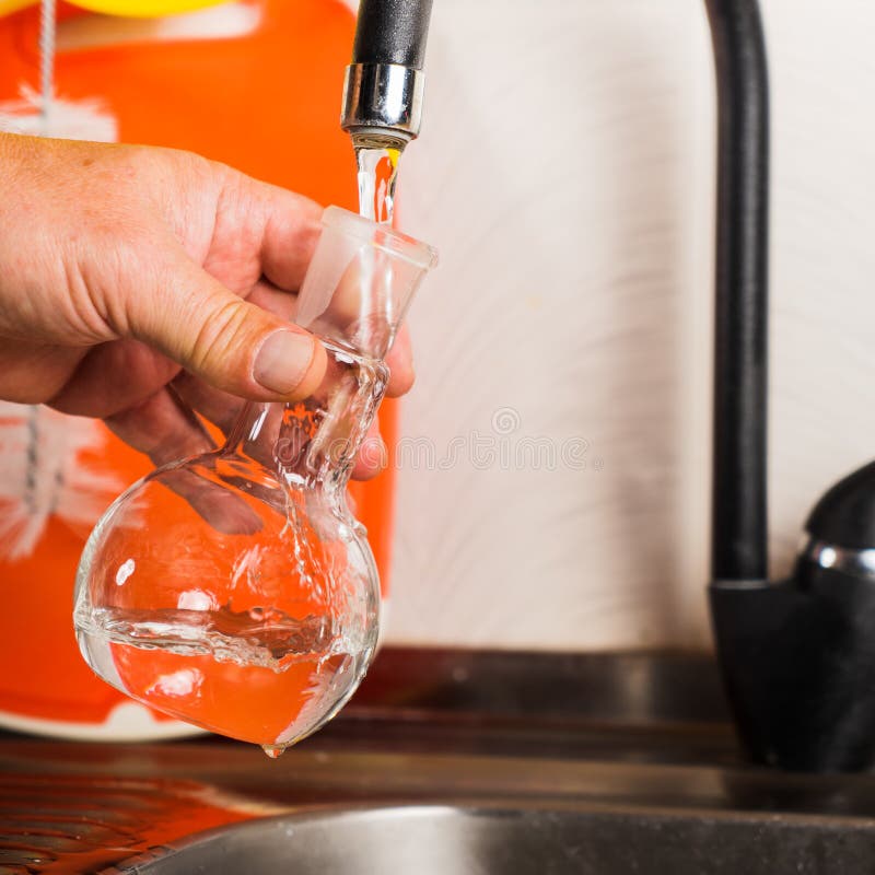 A Man Pours Tap Water into a Glass Flask Stock Image - Image of ...