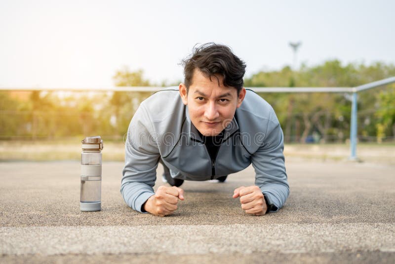 Man Practice Planking Exercise Outdoors with Water Bottle Stock Photo ...