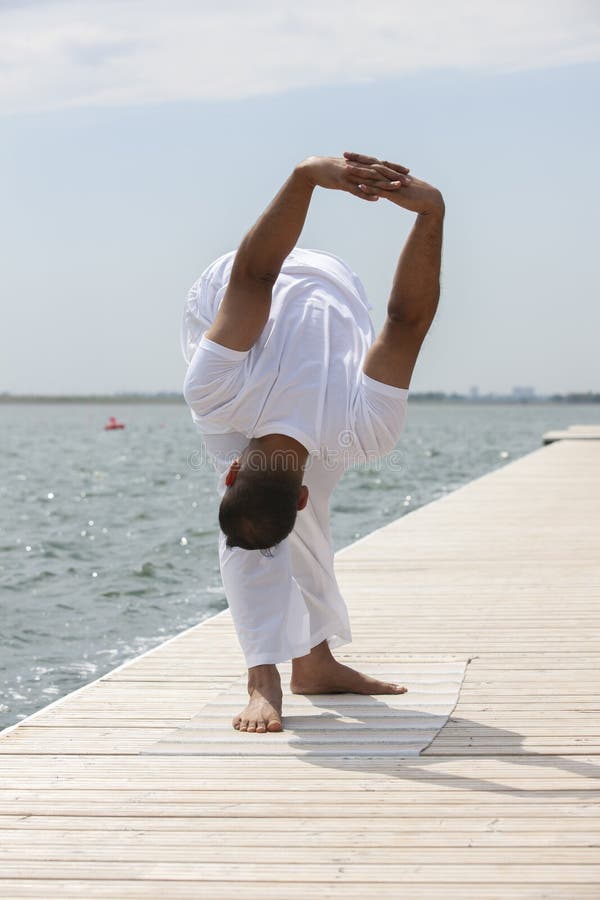 Man Practice Yoga on the Beach at Sunset Stock Photo - Image of peace ...