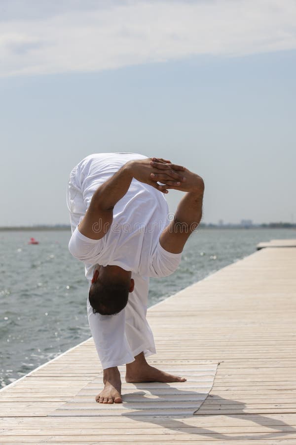 Man Practice Yoga on the Beach at Sunset Stock Image - Image of ...