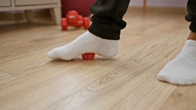 Man Practicing Foot Exercise with Red Ball in Rehabilitation Clinic ...