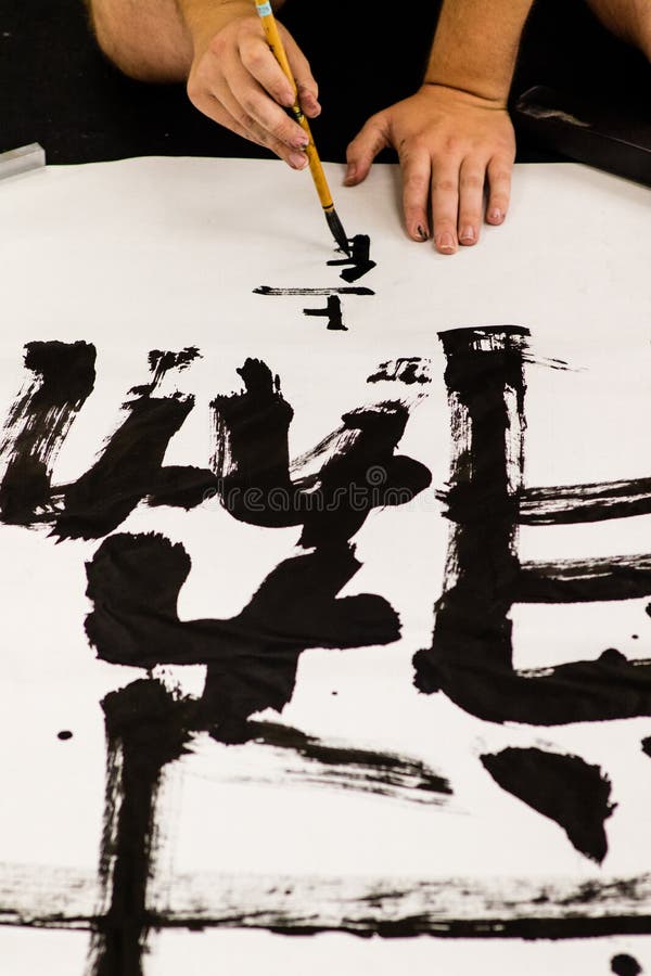A Man Practicing Japanese Calligraphy Editorial Image - Image of finger ...