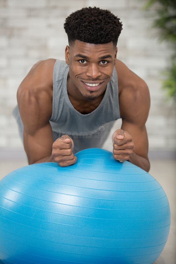 Man Practicing Plank Exercise Using Ball At Gym Stock Image Image Of Model Body 256659427