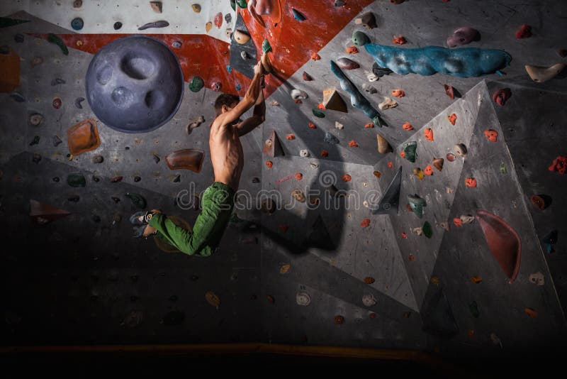 Man Practicing Rock-climbing on a Rock Wall Indoors Stock Image - Image ...
