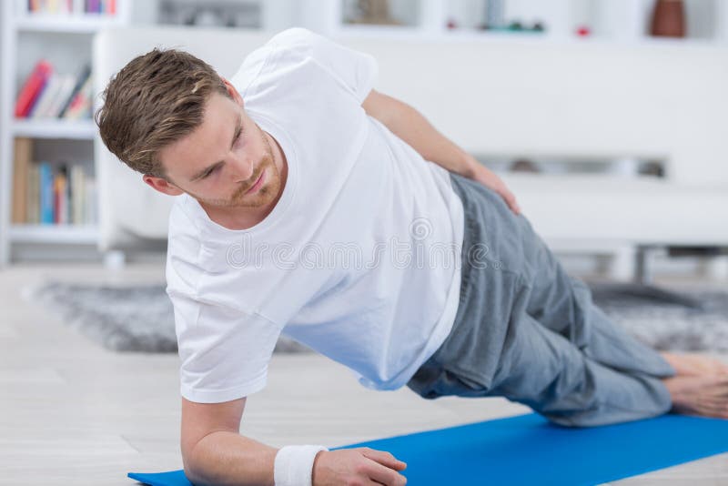Man Practicing Yoga on Floor Stock Photo - Image of camera, youth ...