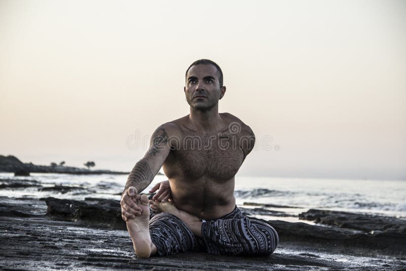 Man practicing yoga stock photo. Image of class, nature - 73978498