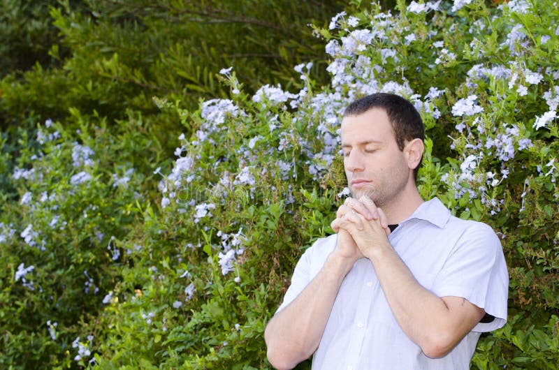 Man praying alone outside. stock photo. Image of outside - 83904444
