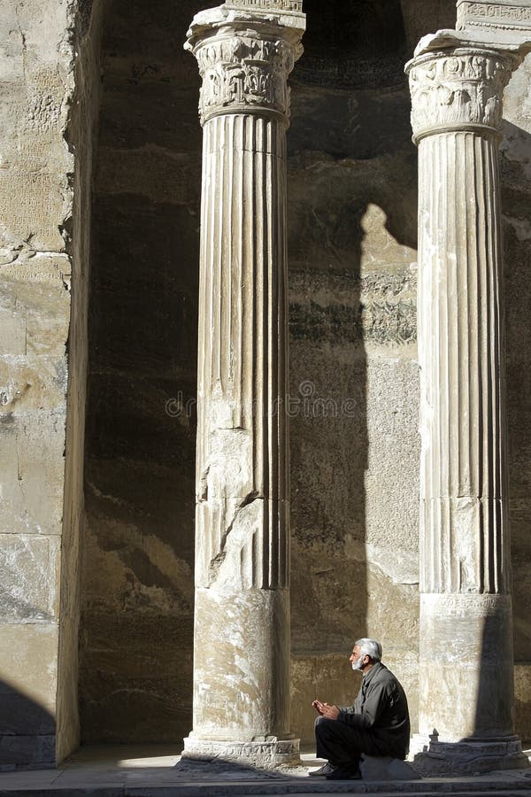 A Man Praying in an Ancient Roman Temple Surrounded by Marble Columns ...
