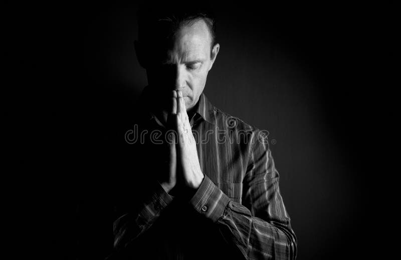 A Man Praying Holding a Bible. Stock Photo - Image of color, faith ...