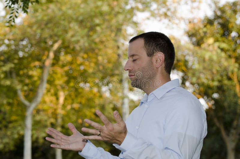 Man Lifting Hands In Prayer Stock Photo - Image of worship, male: 15681676