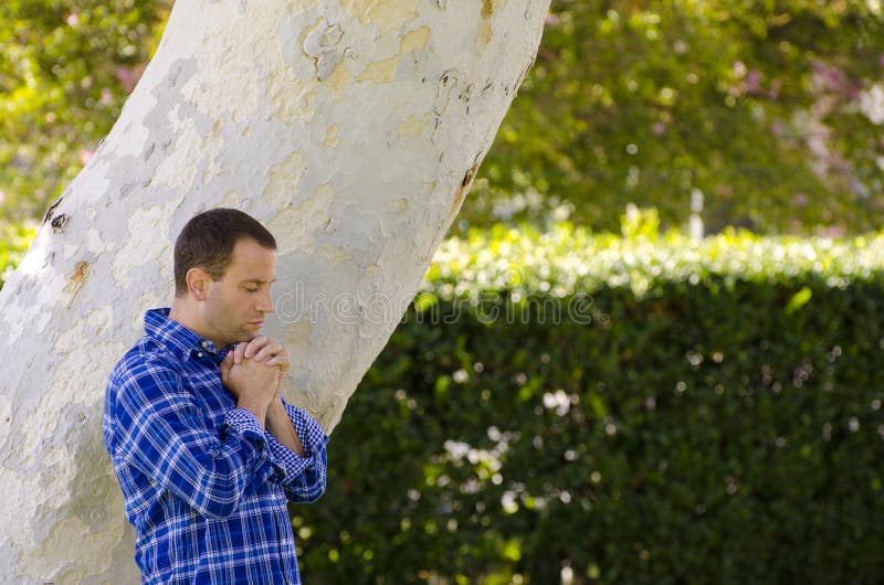 Praying Outdoors with a Bible Stock Image - Image of thinking, hand ...