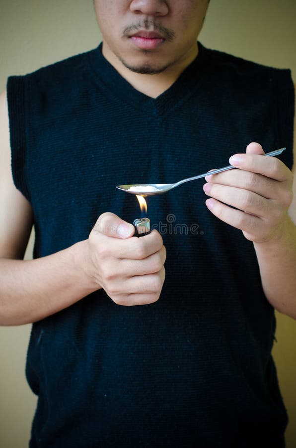 Man prepares drug in spoon stock image. Image of forbidden - 52730231