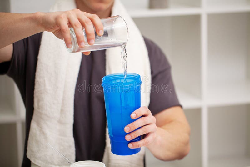 Man Prepares a Protein Shake in the Shaker after Training Stock Photo ...