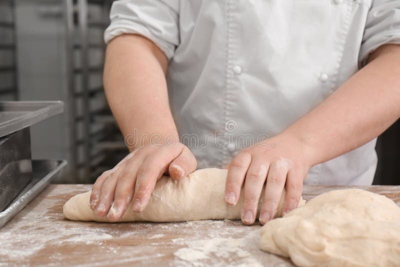 Man Preparing Bread Dough on Wooden Table in a Bakery Close Up ...