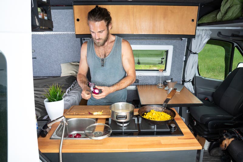 Man Preparing Food Inside His Caravan Stock Photo - Image of travel ...