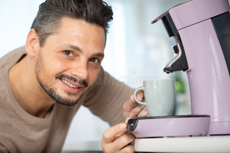 Man Preparing Hot Drink Using Coffee Machine Stock Image - Image of ...