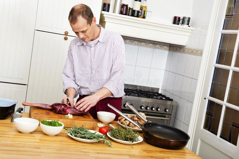 Man Preparing Meat in Kitchen Stock Photo - Image of person, cooking ...