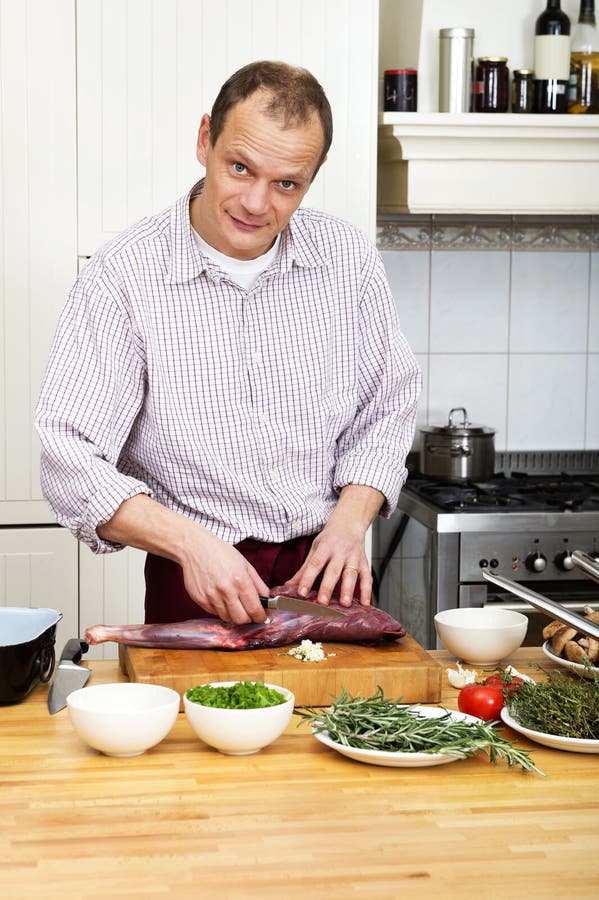 Man Preparing Meat at Kitchen Counter Stock Photo - Image of person ...